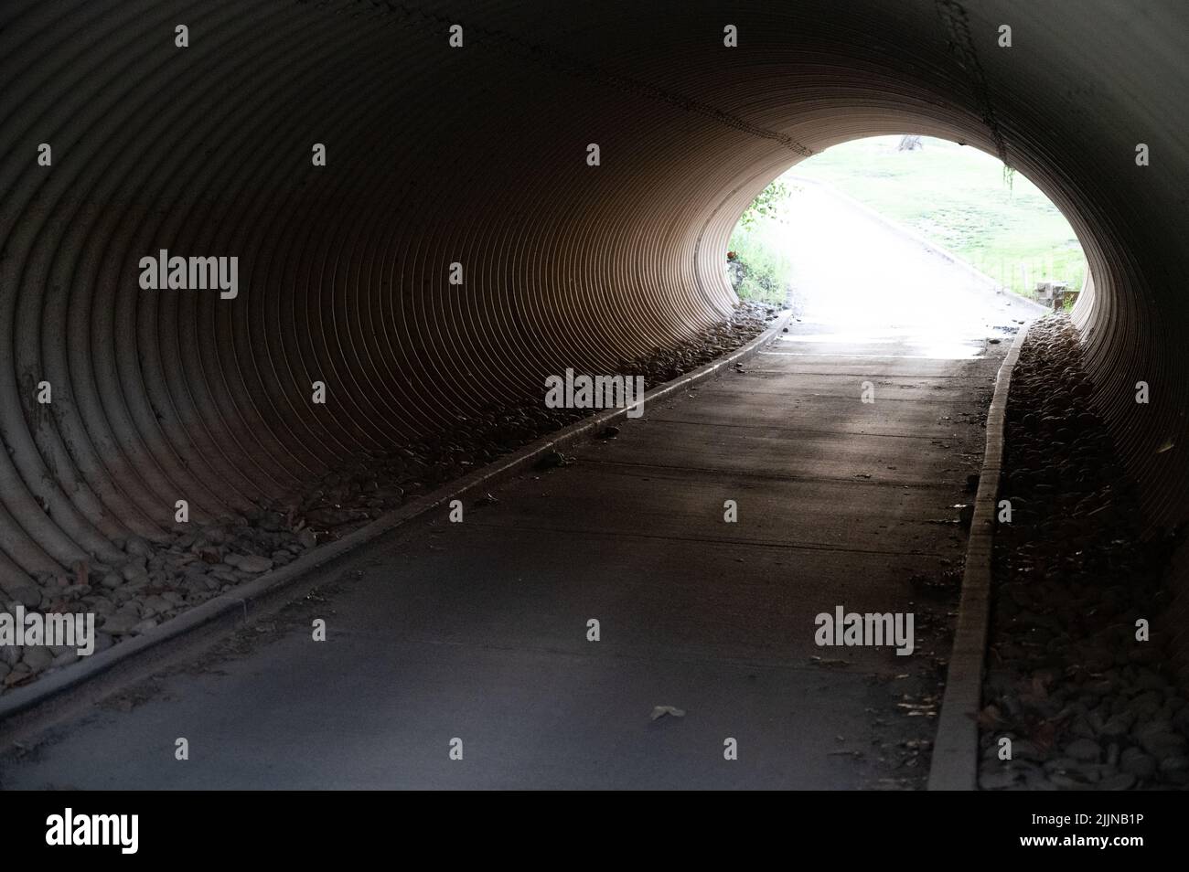 A tunnel leading to the natural landscape Stock Photo - Alamy