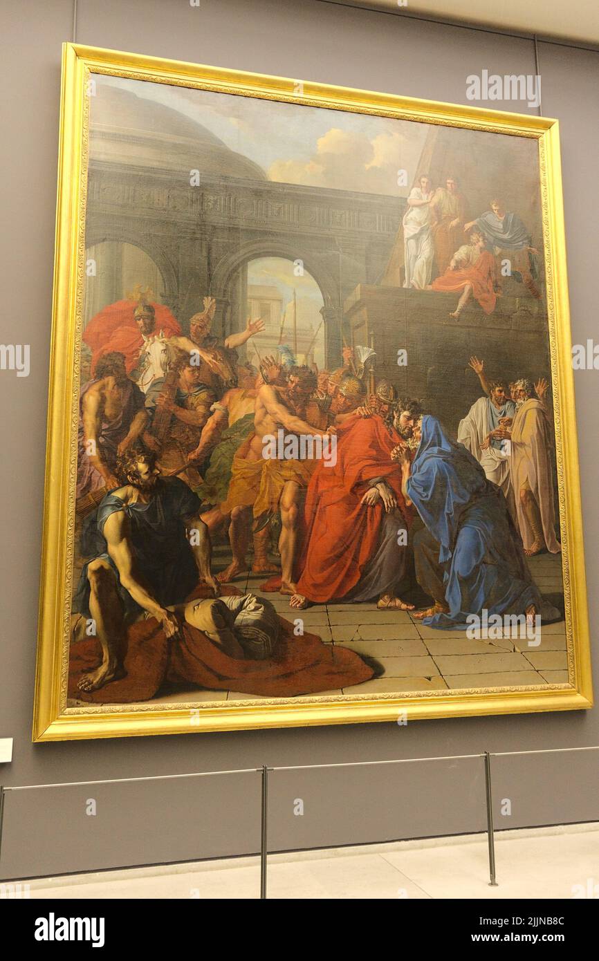 A vertical shot of a painting on the wall of the Louvre museum, Paris ...