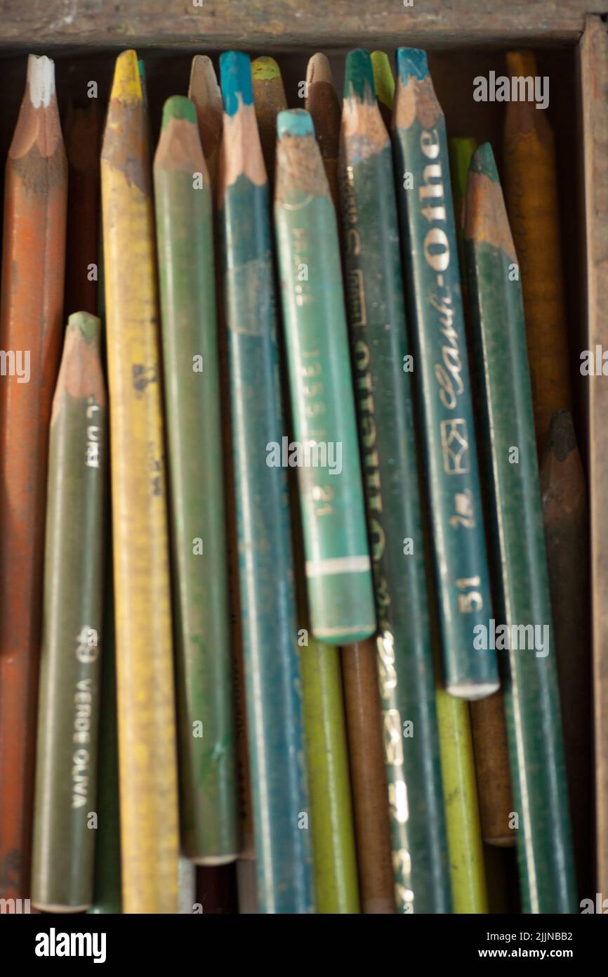A vertical shot of used green colored pencils Stock Photo - Alamy