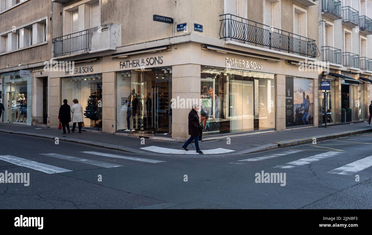 The Father and Son front store facade view with logo and signage, a ...