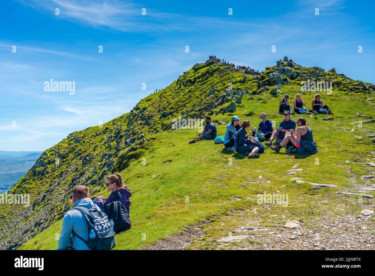 SNOWDON, WALES - JULY 09, 2022: Hikers on the summit of the Mount ...