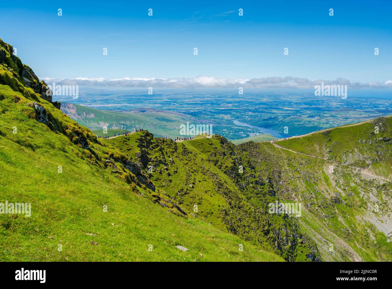 SNOWDON, WALES - JULY 09, 2022: Hikers admire views from the summit of ...