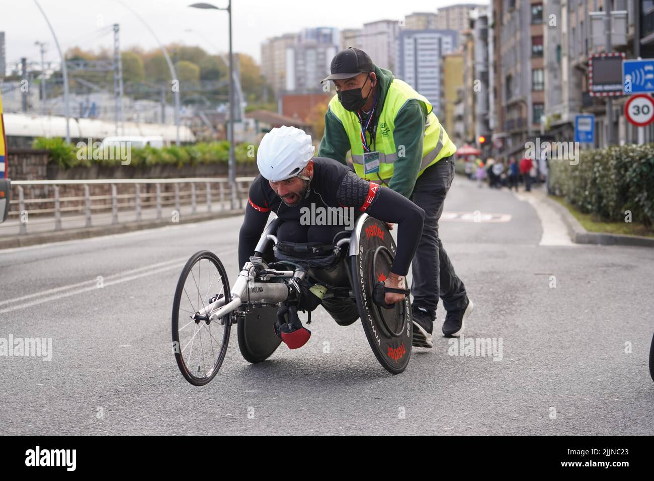 The workers helping a runner in the Behobia San Sebastian race for the ...