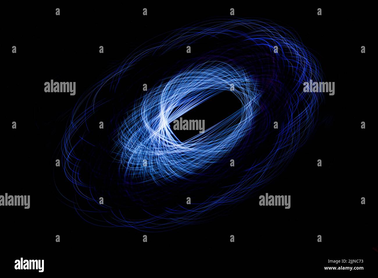 A digital render of abstract blue spiral lines on a black background ...