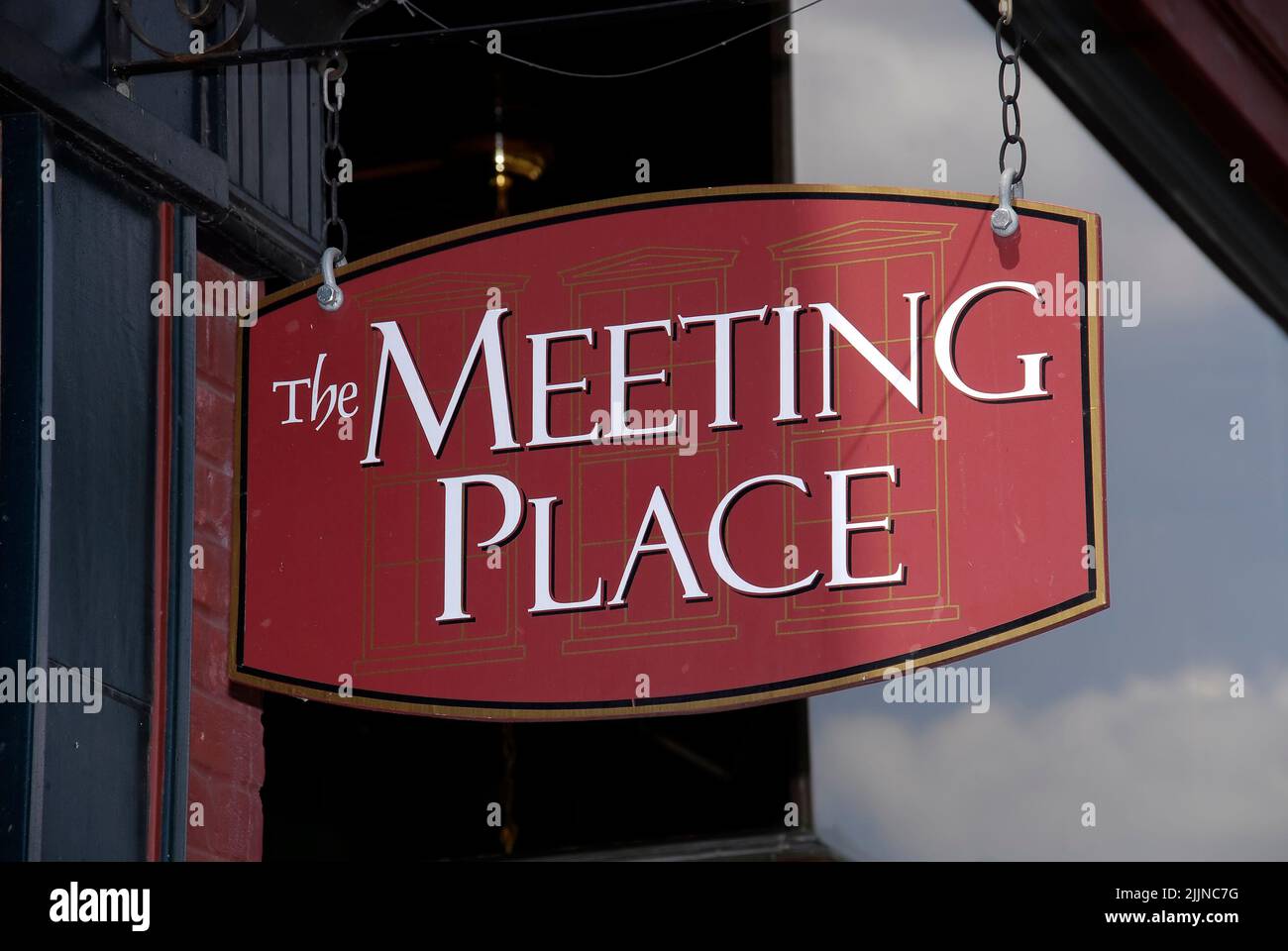 The close-up shot of a restaurant sign hanging outside of the business ...