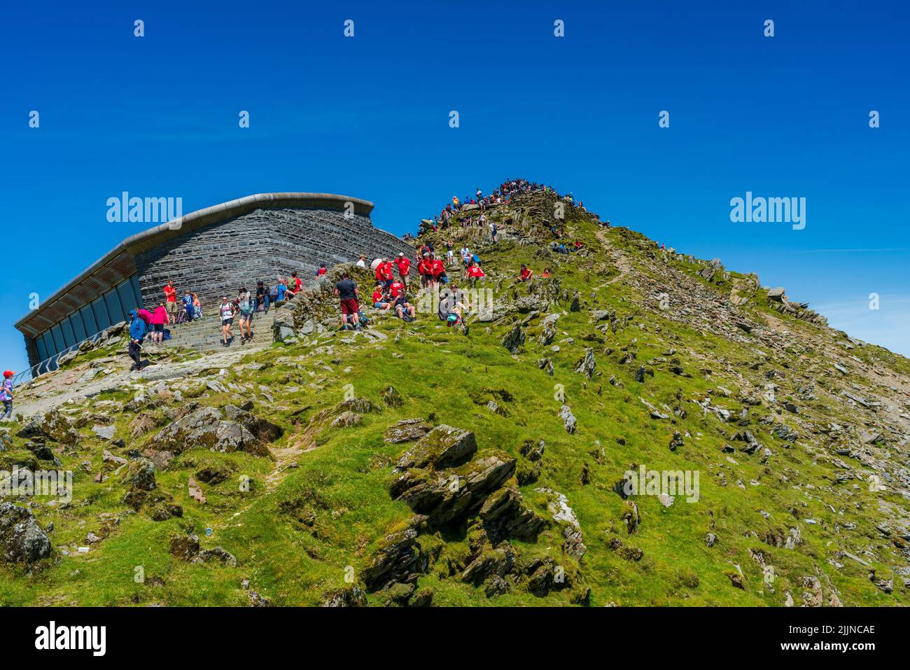 SNOWDON, WALES - JULY 09, 2022: Hikers climb Mount Snowdon to reach the ...
