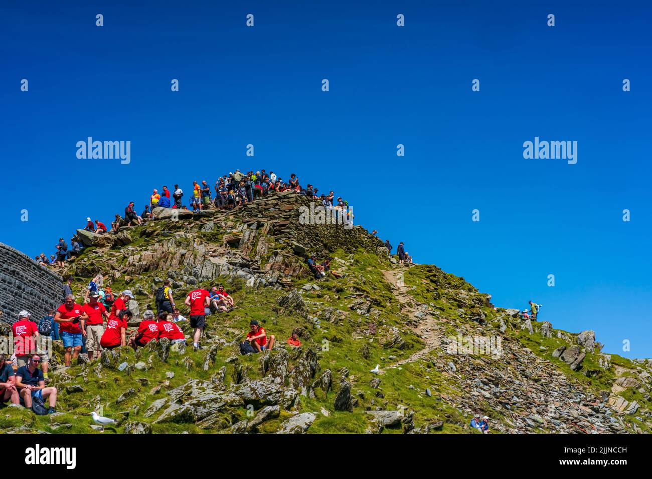 SNOWDON, WALES - JULY 09, 2022: Hikers crowd summit of the Mount ...