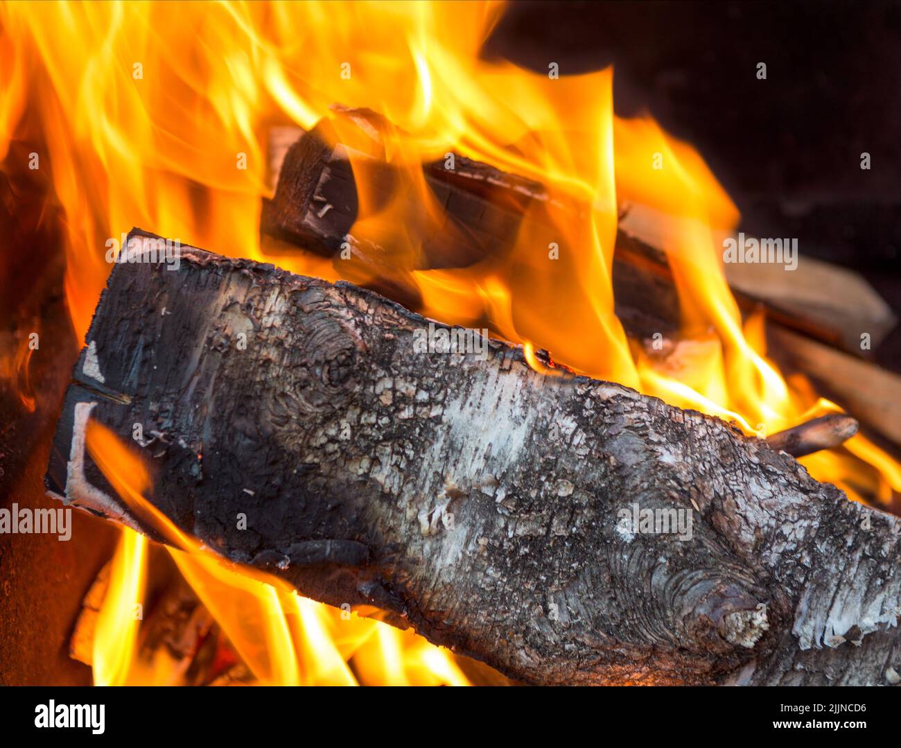 Burning Wood. Campfire flames over burning logs Stock Photo - Alamy