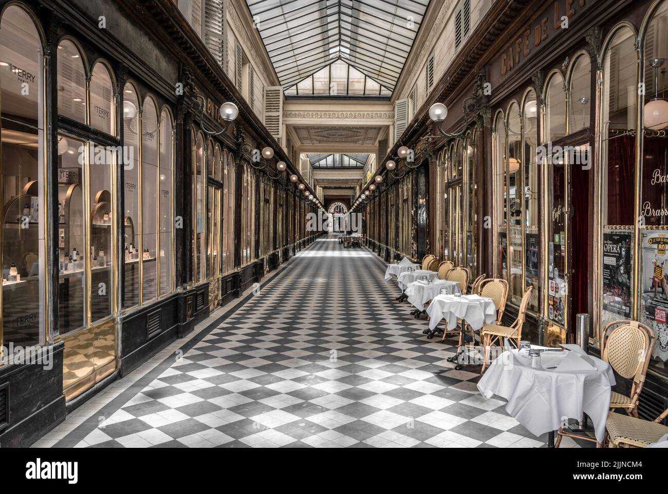 A veiw of a small indoor street in Paris, France, with fancy stores and ...