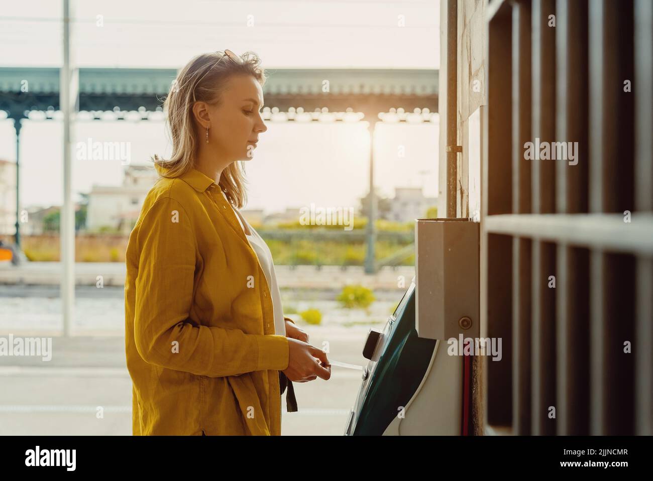 Commuter validating train ticket hi-res stock photography and images - Alamy