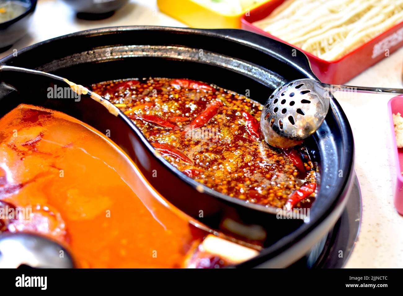 The traditional asian hot pot dish in a restaurant Stock Photo - Alamy