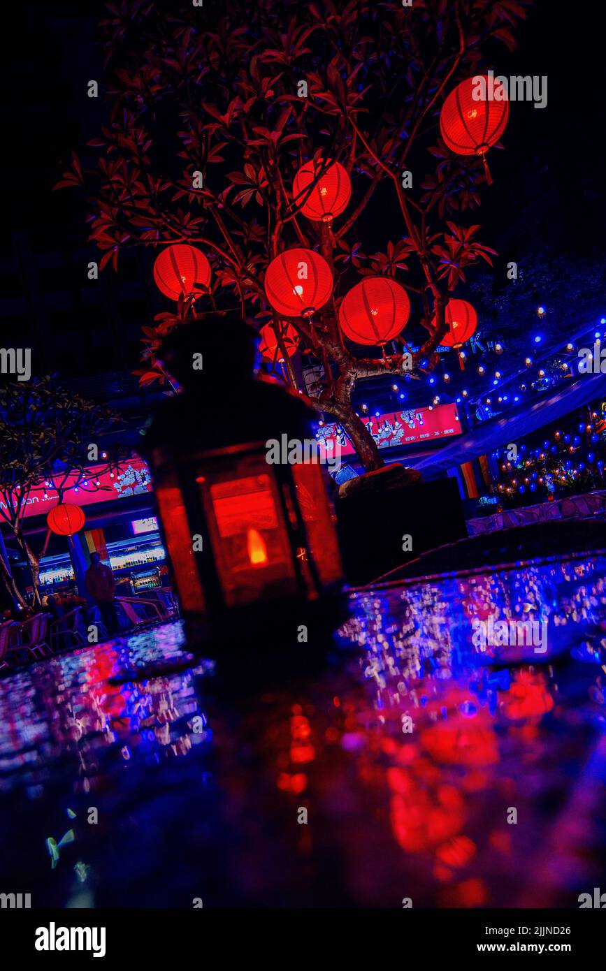 A Lantern sits in front of an iconic tree lantern display Stock Photo ...