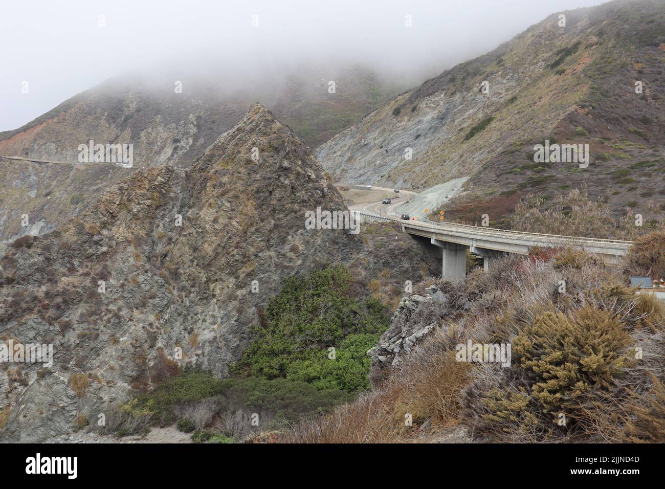 A coastal highway through the oceanside cliffs in Big Sur, California ...