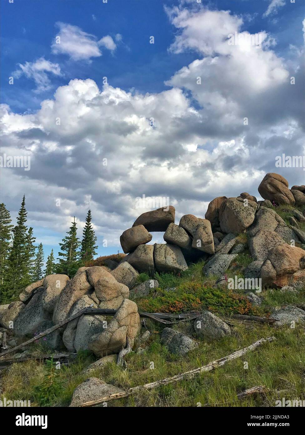 A vertical shot of piles of huge rocks on a slope Stock Photo - Alamy