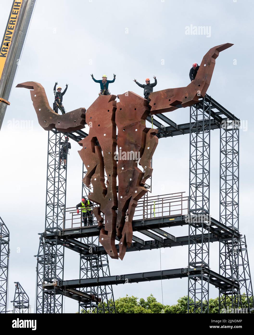 Wacken, Germany. 27th July, 2022. Workers cheer after finishing ...