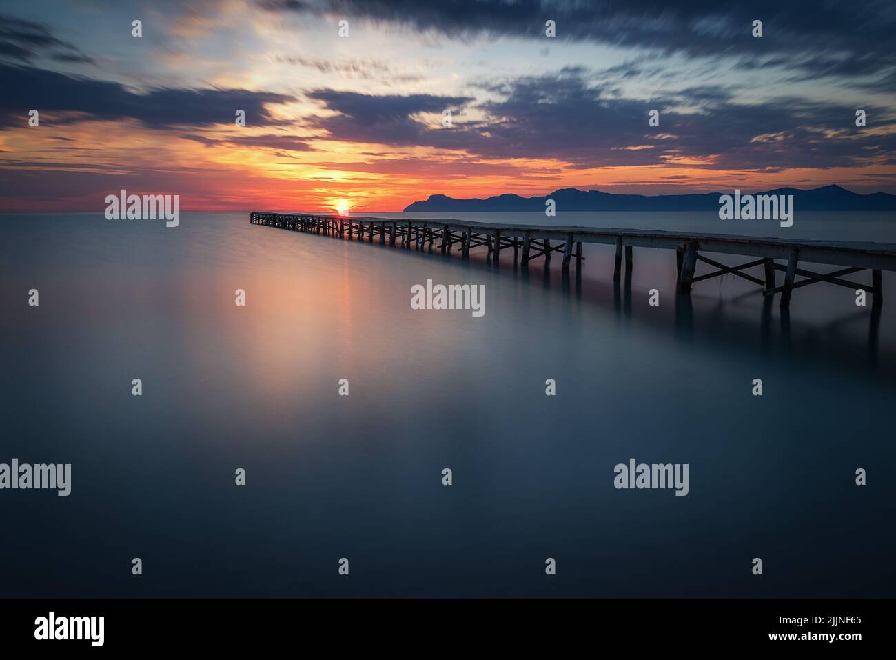 The pier during early morning as long exposure image Stock Photo - Alamy