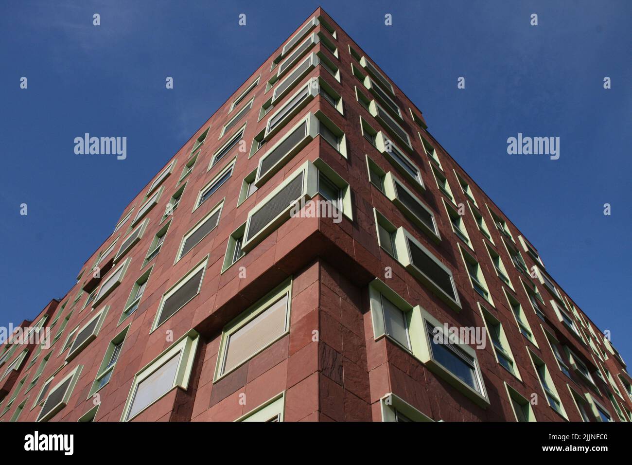 A low angle shot of a Modern apartment building in the downtown of ...