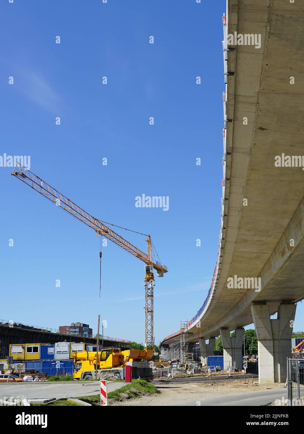 New modern road overpass concrete bridge construction site with yellow ...
