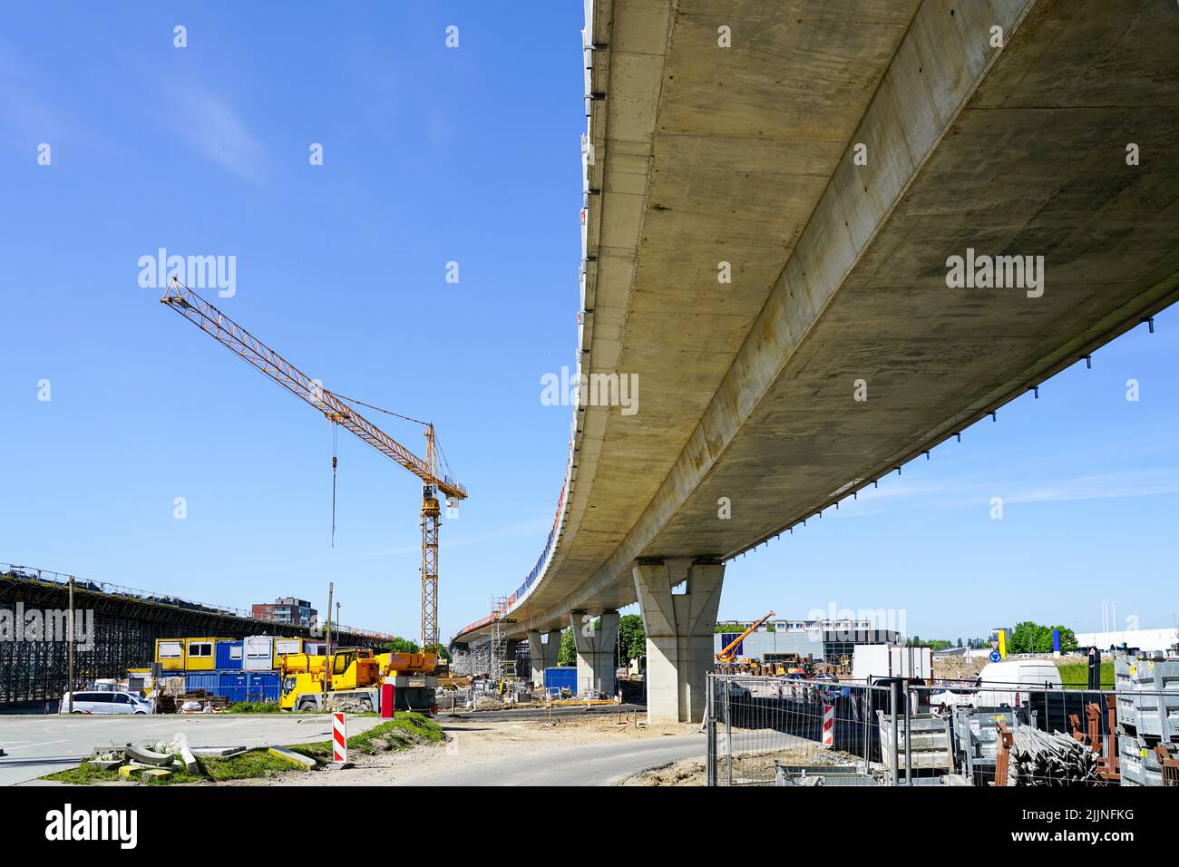 New modern road overpass concrete bridge construction site with yellow ...