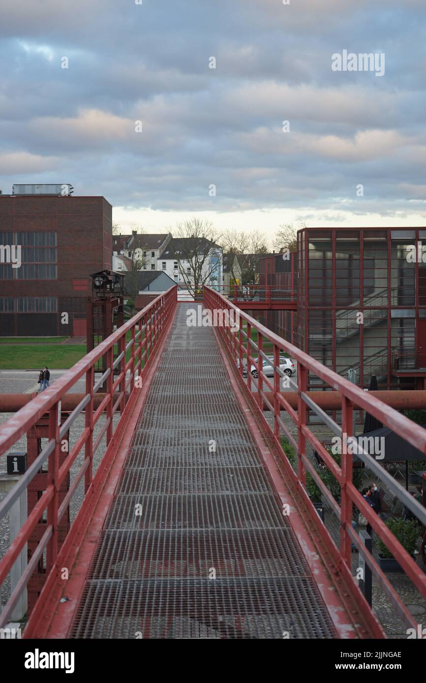 A metal bridge pathway on a cloudy day Stock Photo - Alamy
