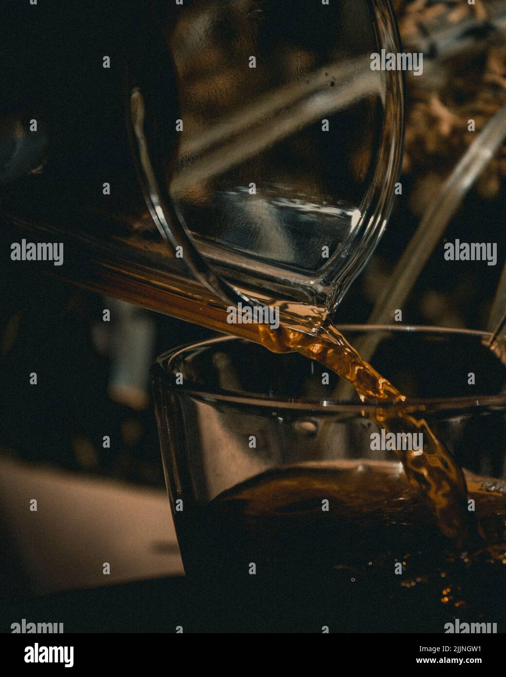 A closeup of hot, fresh tea being poured into a glass Stock Photo - Alamy