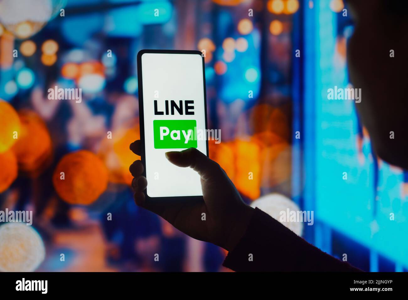 In this photo illustration, the LINE Pay logo is displayed on a ...