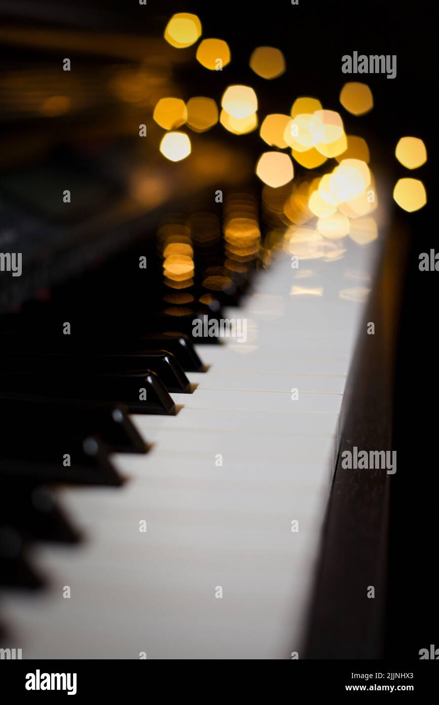 A closeup of piano keys with bokeh lights Stock Photo - Alamy