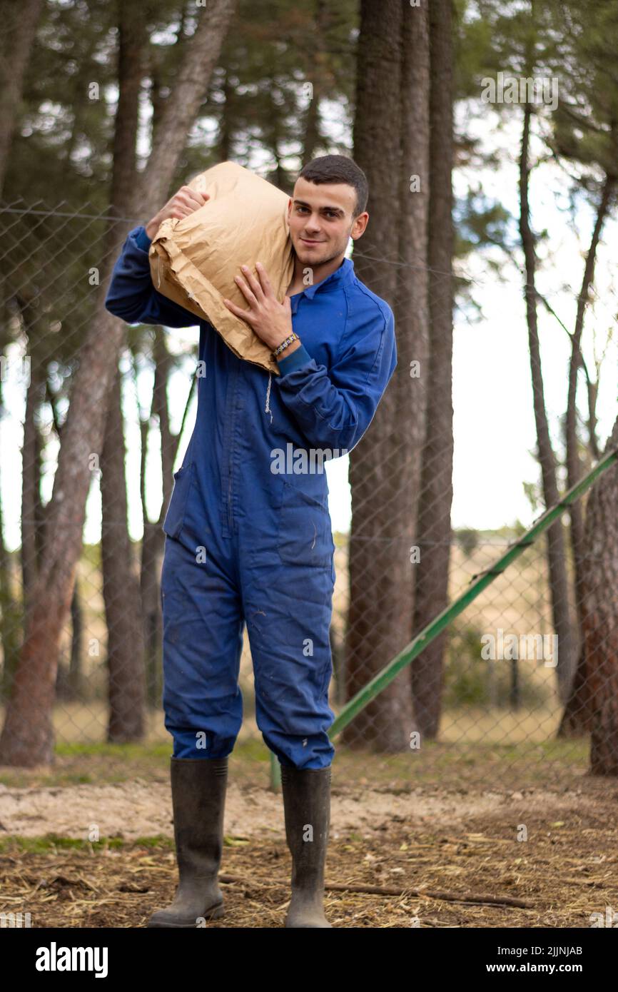 Farmer carrying grain sack hi-res stock photography and images - Alamy