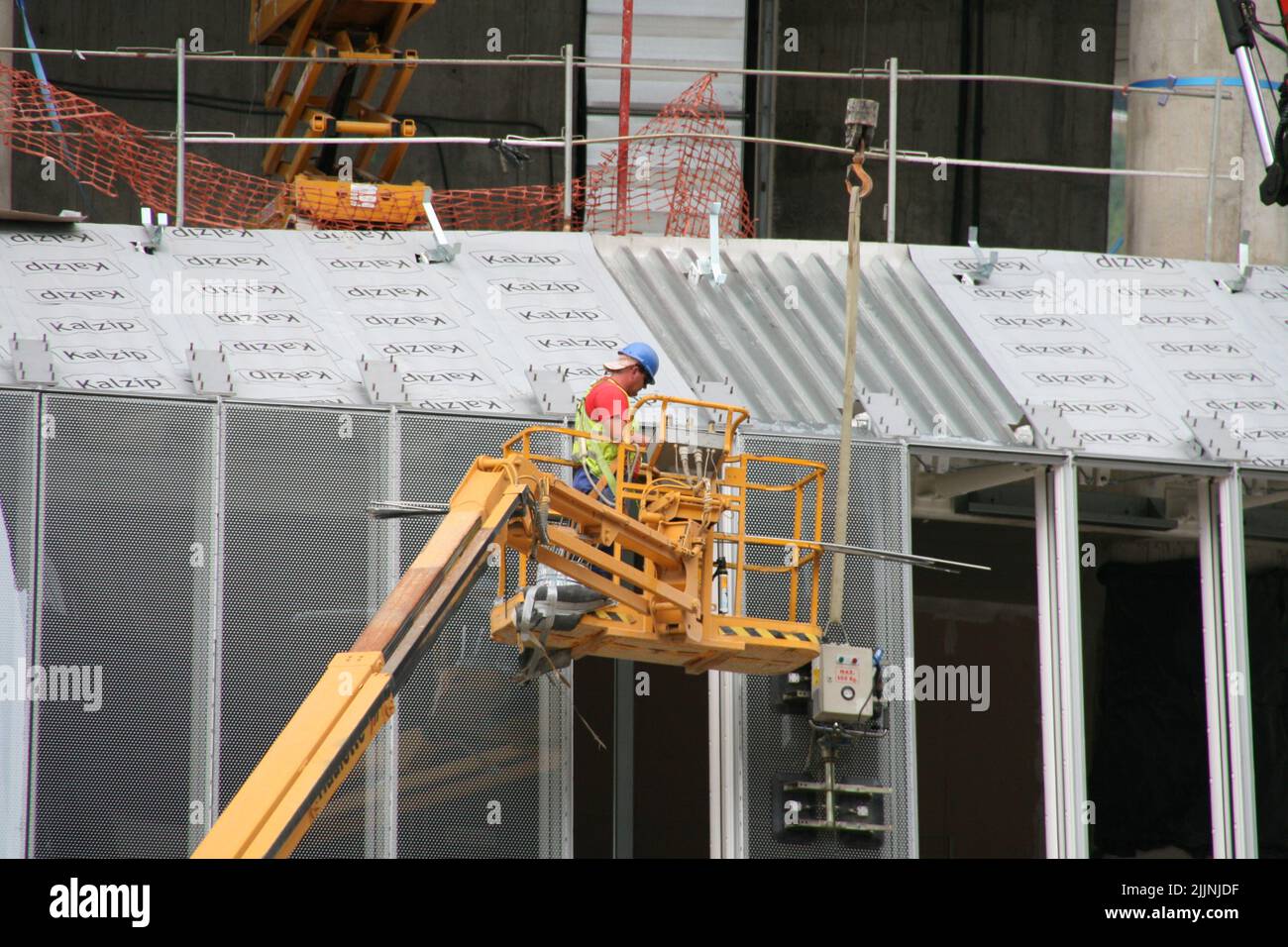 The worker on a crane on a construction site. Bilbao, Spain Stock Photo ...