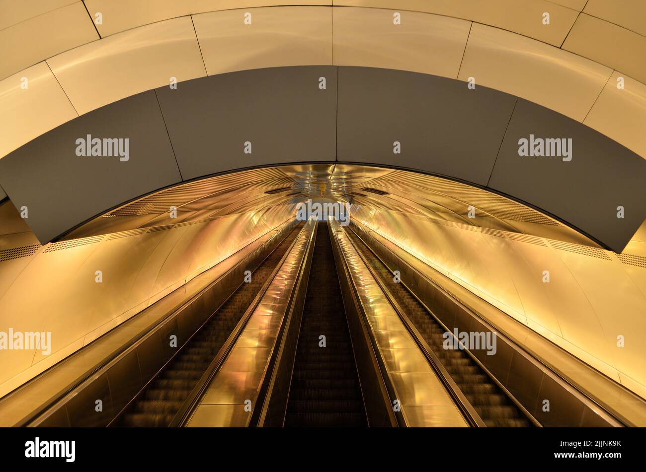 A low angle shot of two escalators inside modern building with ...