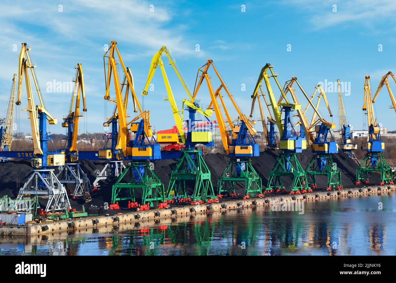 A view of colorful Industrial cranes in process at the Port of Riga ...