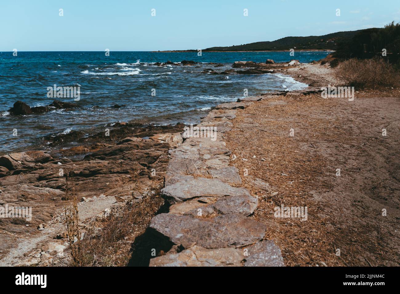 The rocky beach in Sardegna, Italy Stock Photo - Alamy