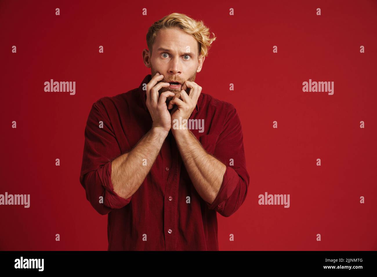 White bearded man wearing shirt expressing surprise at camera isolated ...