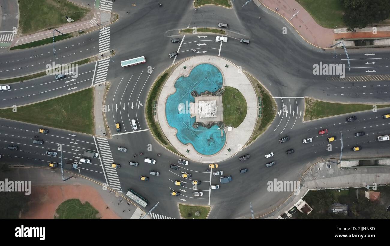 Aerial shot made with drone of a roundabout in the streets of the city ...