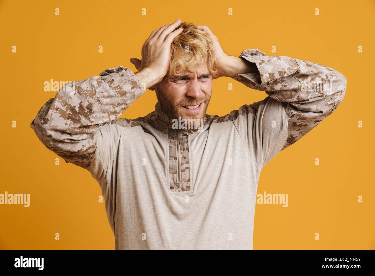 White military man with headache frowning and holding his head isolated ...