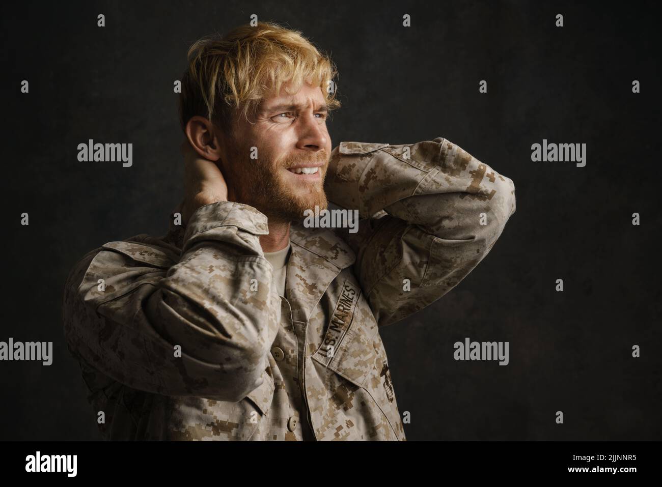 White military man wearing uniform frowning and looking aside isolated ...