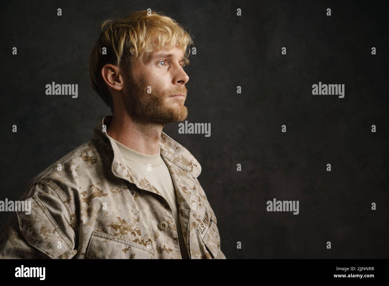 White military man wearing uniform posing and looking aside isolated ...
