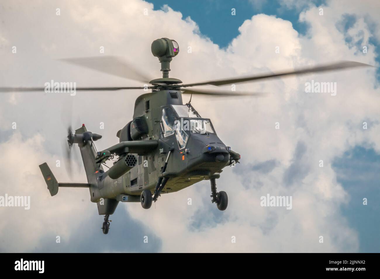 A view of a military helicopter flug propeller tornado high in the sky ...