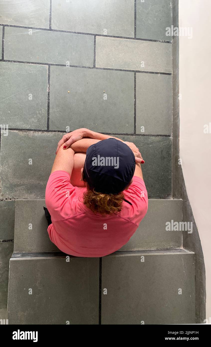 Overhead view of a runner sitting on steps before her run Stock Photo ...