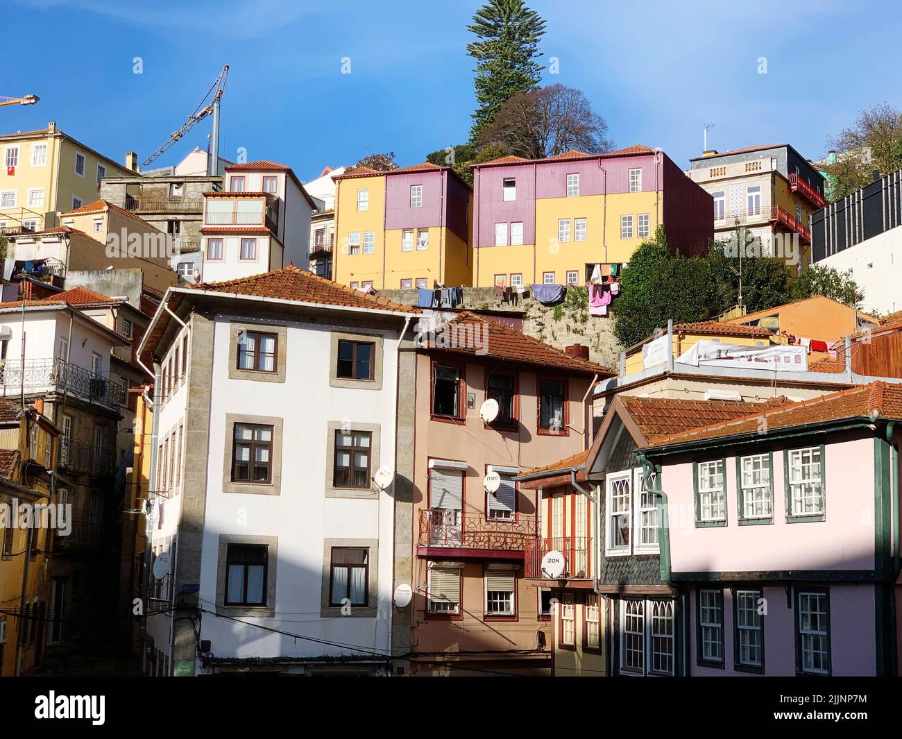 The sunny weather and colorful houses in Porto, Portugal Stock Photo ...