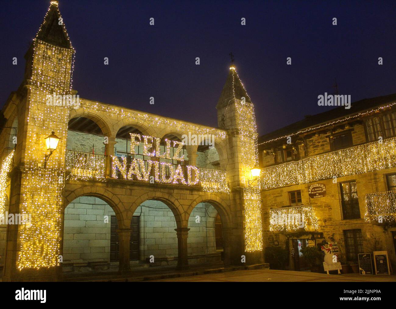 An illuminated Feliz Navidad decorated building in Zamora, Spain Stock ...