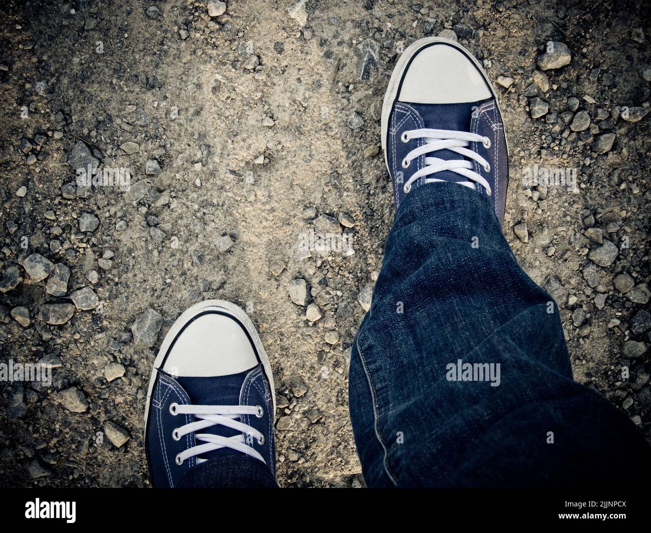 A top view shot of a walking person with white and blue shoes Stock ...