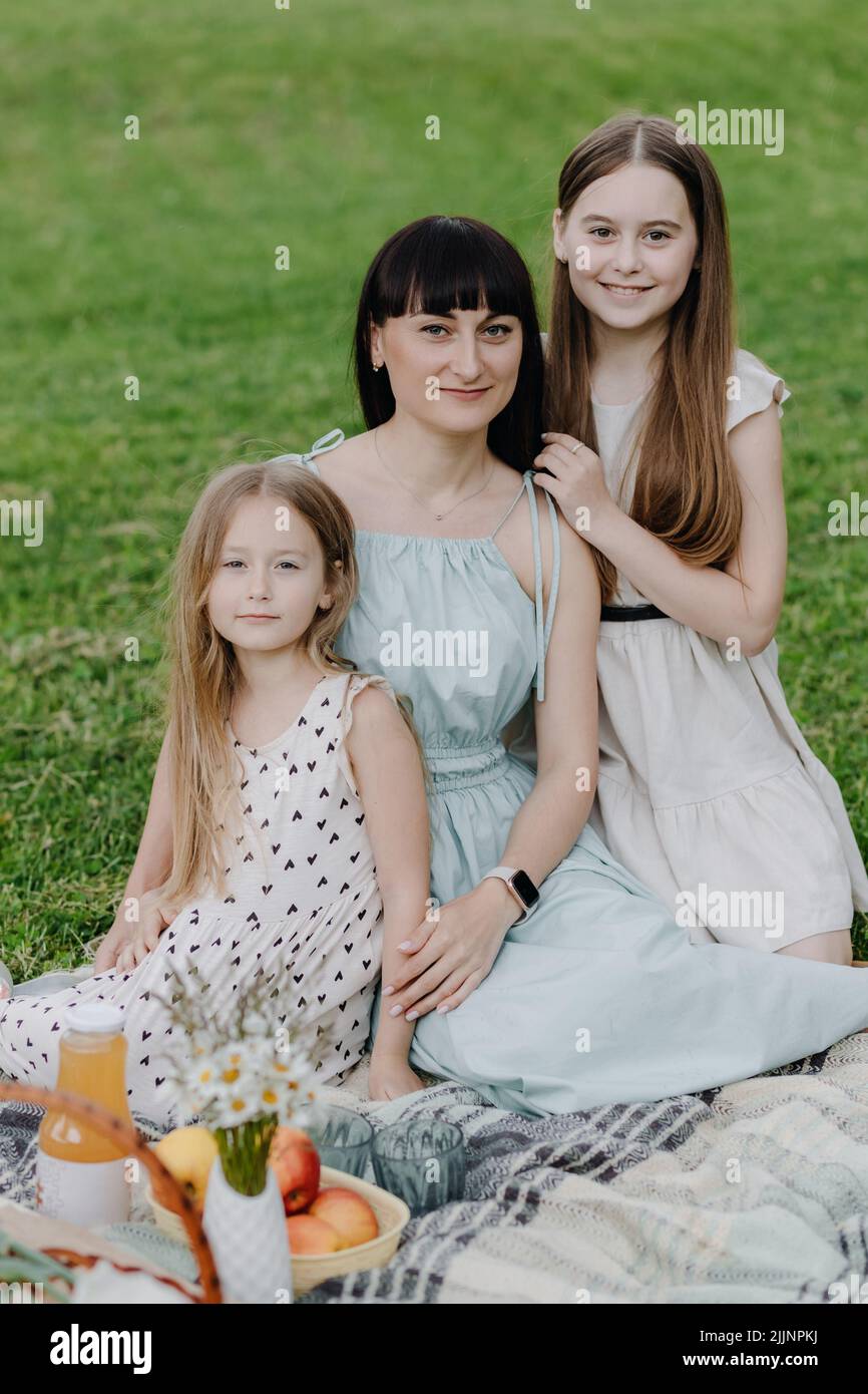 Portrait of happy mum and two daughters. Happy mother with two ...