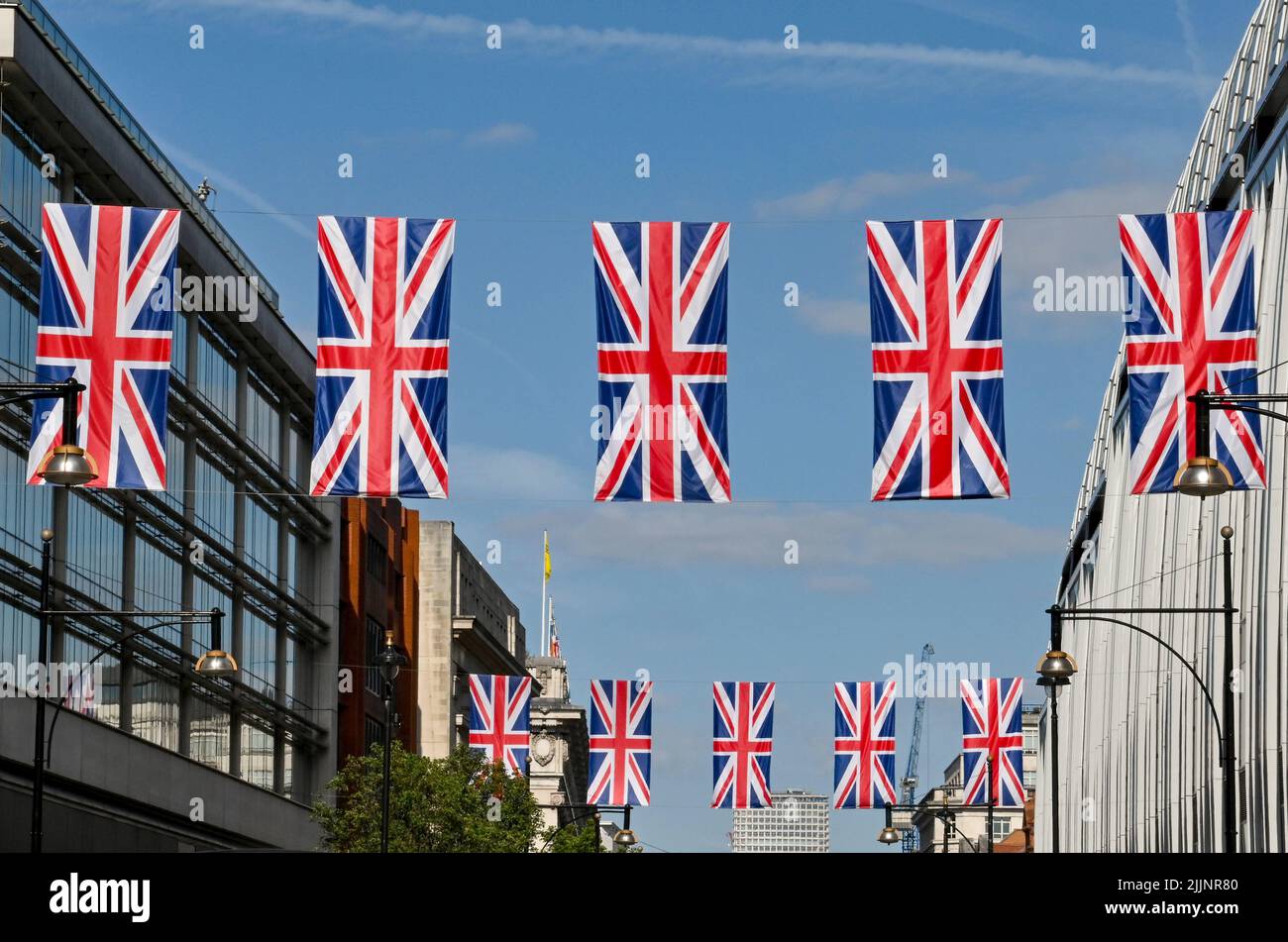 London, England - June 2022: Rows of Union Jack flags hanging over ...