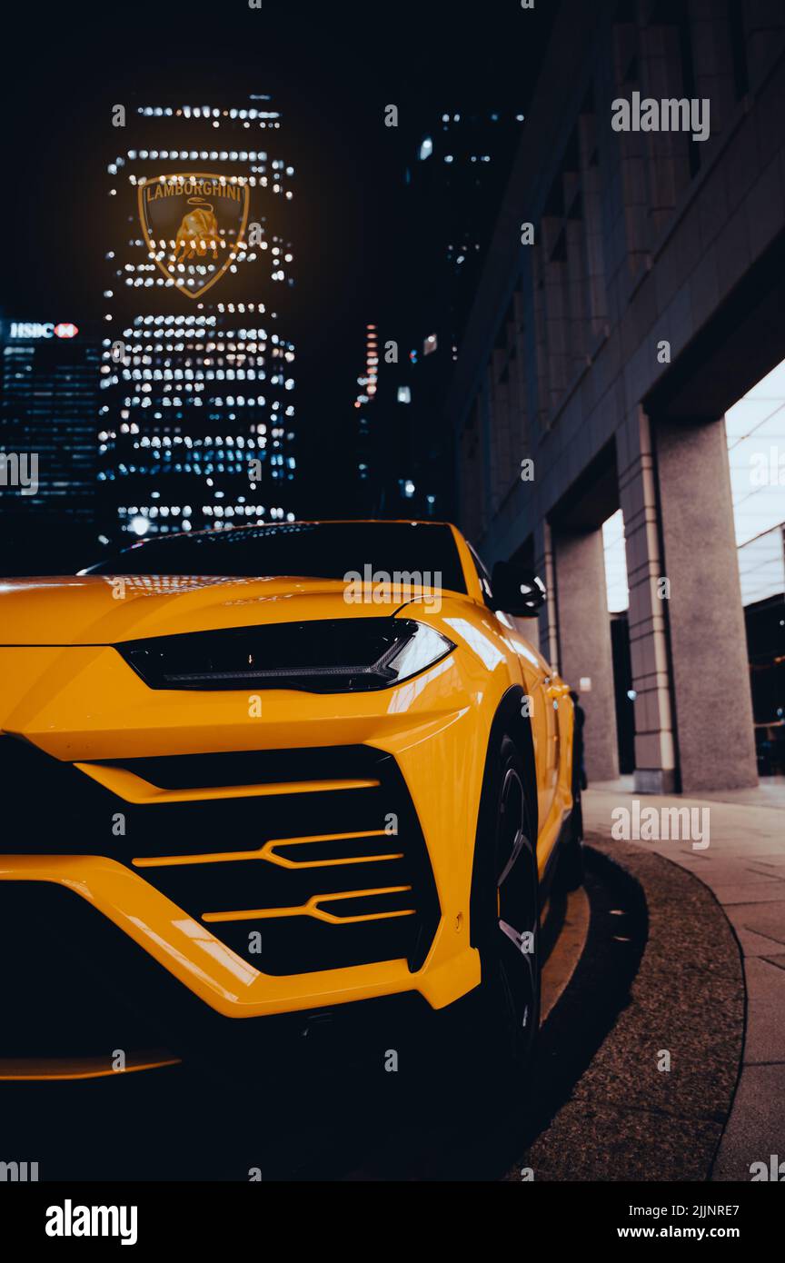A yellow Lamborghini Urus front grill and headlight Stock Photo - Alamy