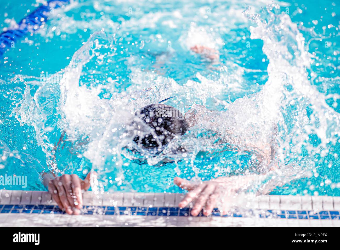 A swimmer in the finish line in the pool Stock Photo - Alamy