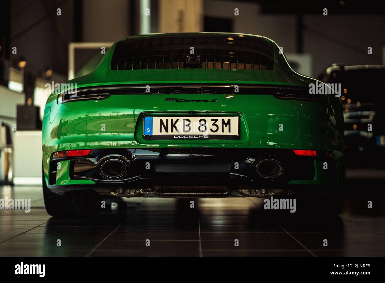 Luxurious green Porsche Carrera S at Porsche center, Orebro, Sweden ...
