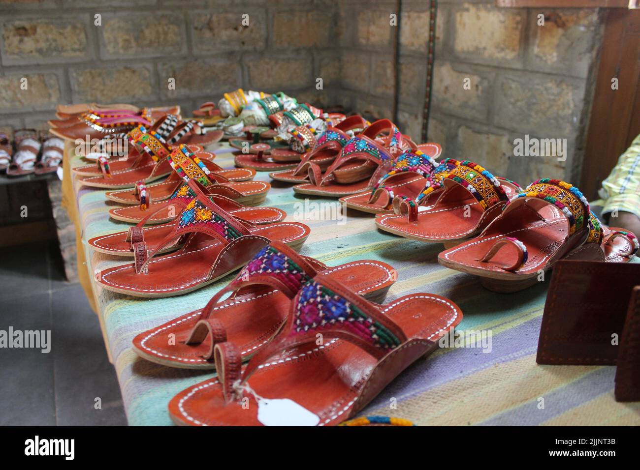 a local made sandals displayed on a table in local market Stock Photo ...