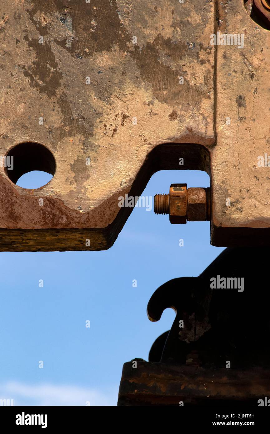 Grunge extreme close-up of rusted metal part of old pump jack with a ...