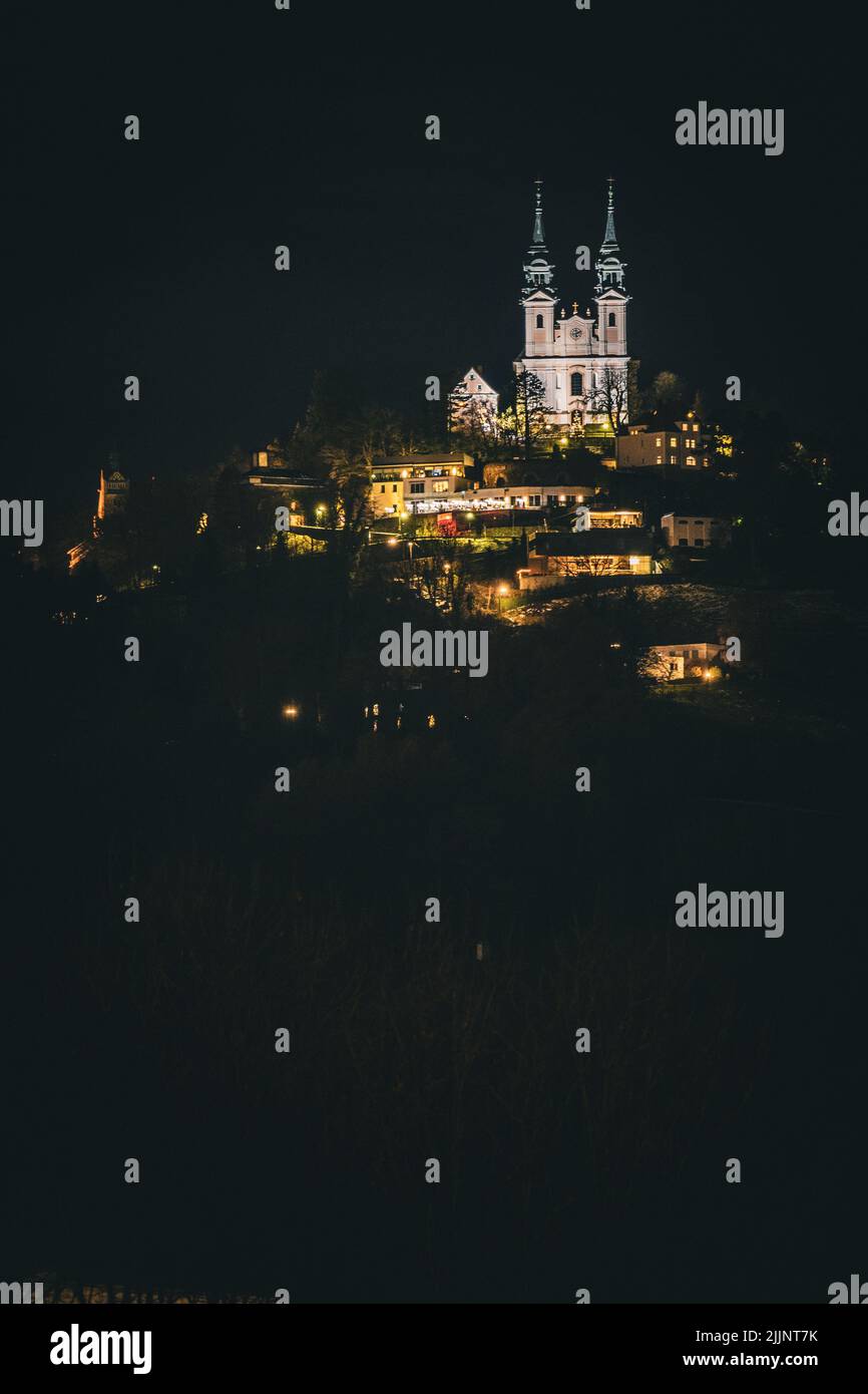 A vertical distant view of the Postlingberg pilgrimage church at night ...